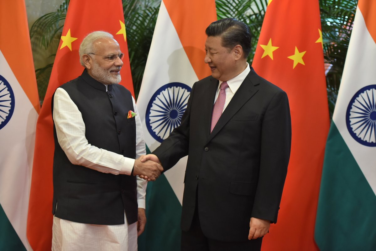 In pics: With warm handshake, Modi-Jinping historic bonhomie grabs ...