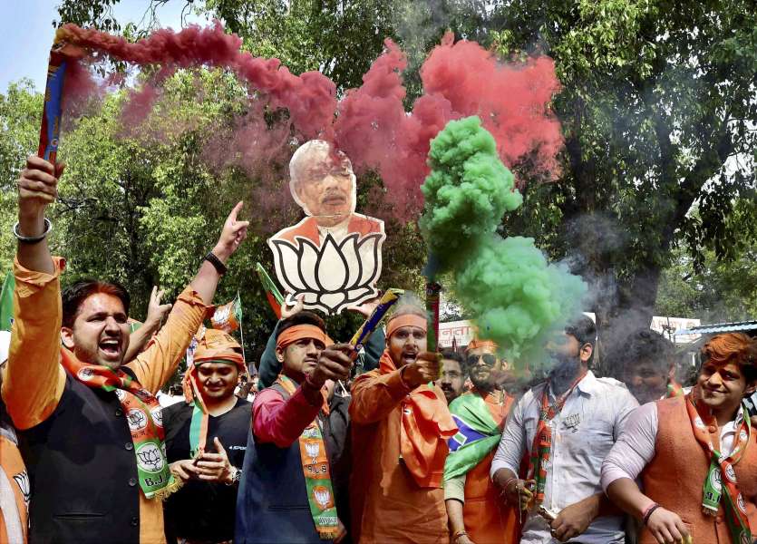 election results 2017 BJP saffron Holi victory style
