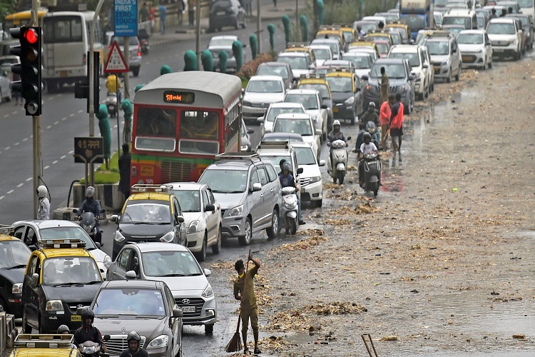 Mumbai rains: High tide spills nearly 361 tonnes of garbage along Marine Drive| See pictures
