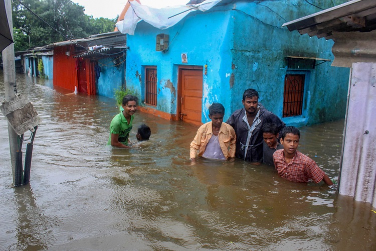 Mumbai rains pictures local train services affected schools closed due ...