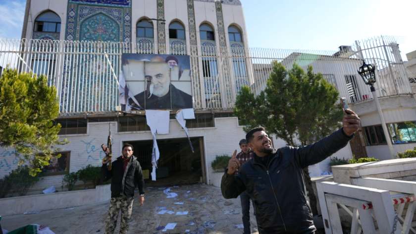 Syrian rebels topple statues as Assad regime collapses | IN PICS