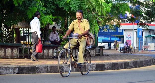 Smartphones and iPads: Dull and drab khaki-clad postman set for ...