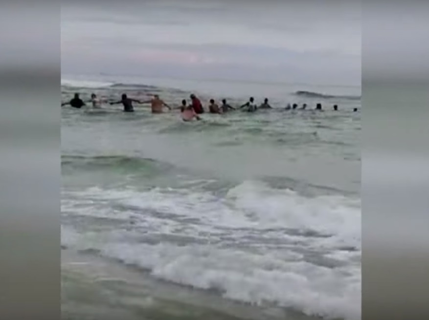 WATCH: Hats off! 80 people form a human chain to save a family from ...