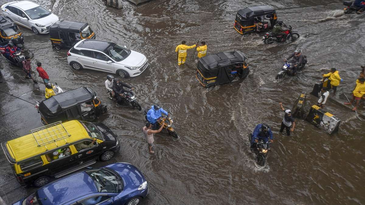 Mumbai rains Parts of city receive heavy showers areas waterlogged IMD alerts traffic jam ...