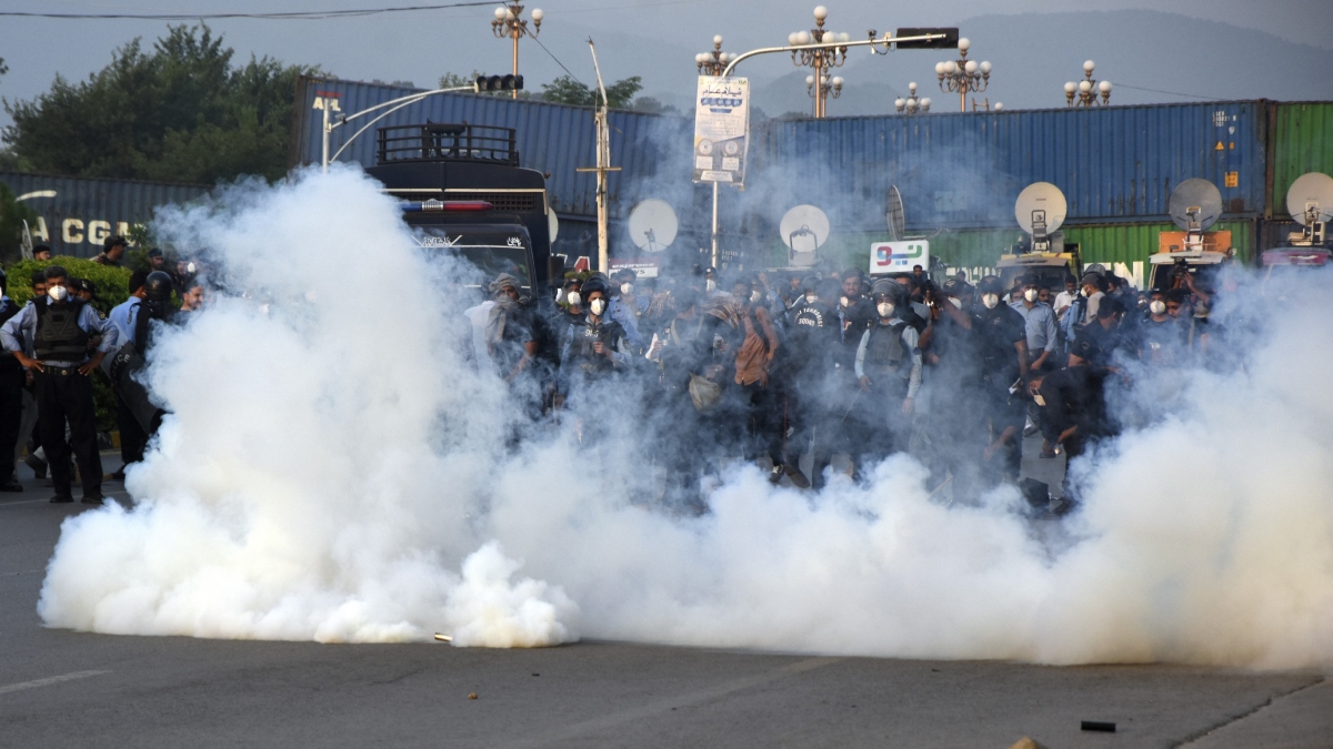 Pakistan in disarray: Police fire tear gas on Imran Khan's supporters ...