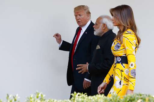 In pics: Melania Trump stuns in a yellow floral-print crepe gown to ...