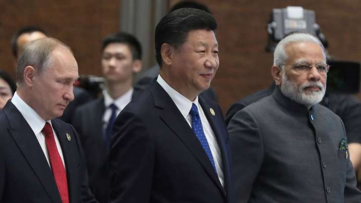 From standing behind Russian President to standing staunchly with Putin ...