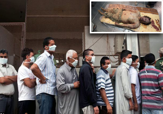 Hundreds Queue Up To Watch Gaddafi, Son's Bodies In Meat Locker | World ...