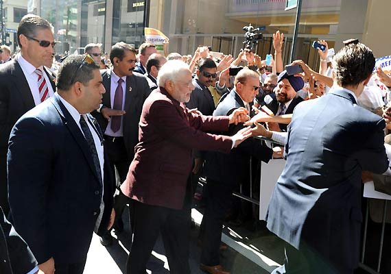 Narendra Modi mingles with crowds, throwing security officials in a ...