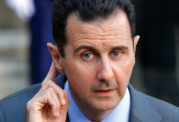 Syria massacre carried out by 'monsters', claims Assad | World News ...