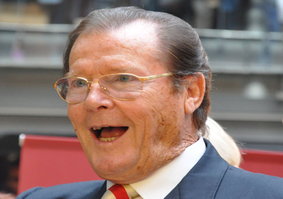 Roger Moore beaten up by former wives | Hollywood News – India TV