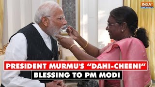 President Murmu offers symbolic “Dahi-Cheeni” blessing to PM Modi ahead ...